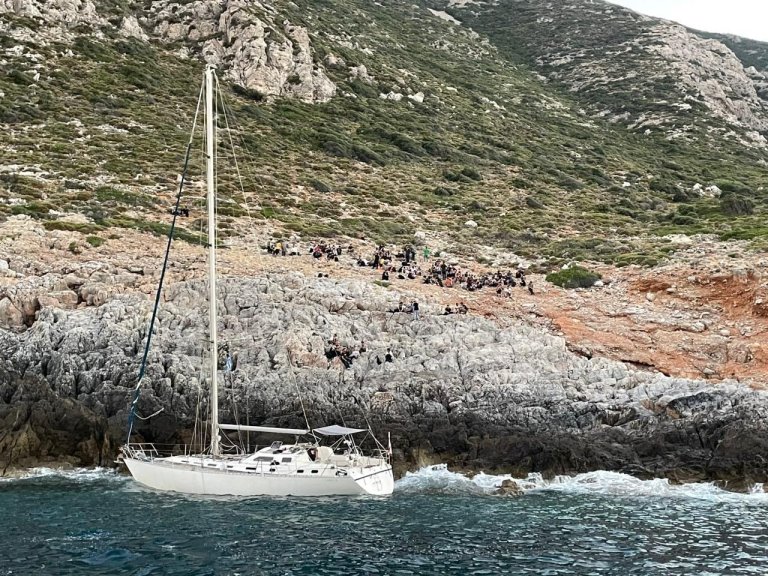 111 migrants perched on cliff brought to safety -- Greek coast guard ...