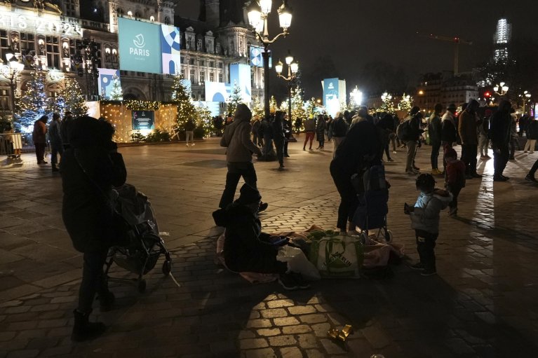 Paris City Hall plaza draws holiday visitors and migrant families seeking shelter as Olympics ...